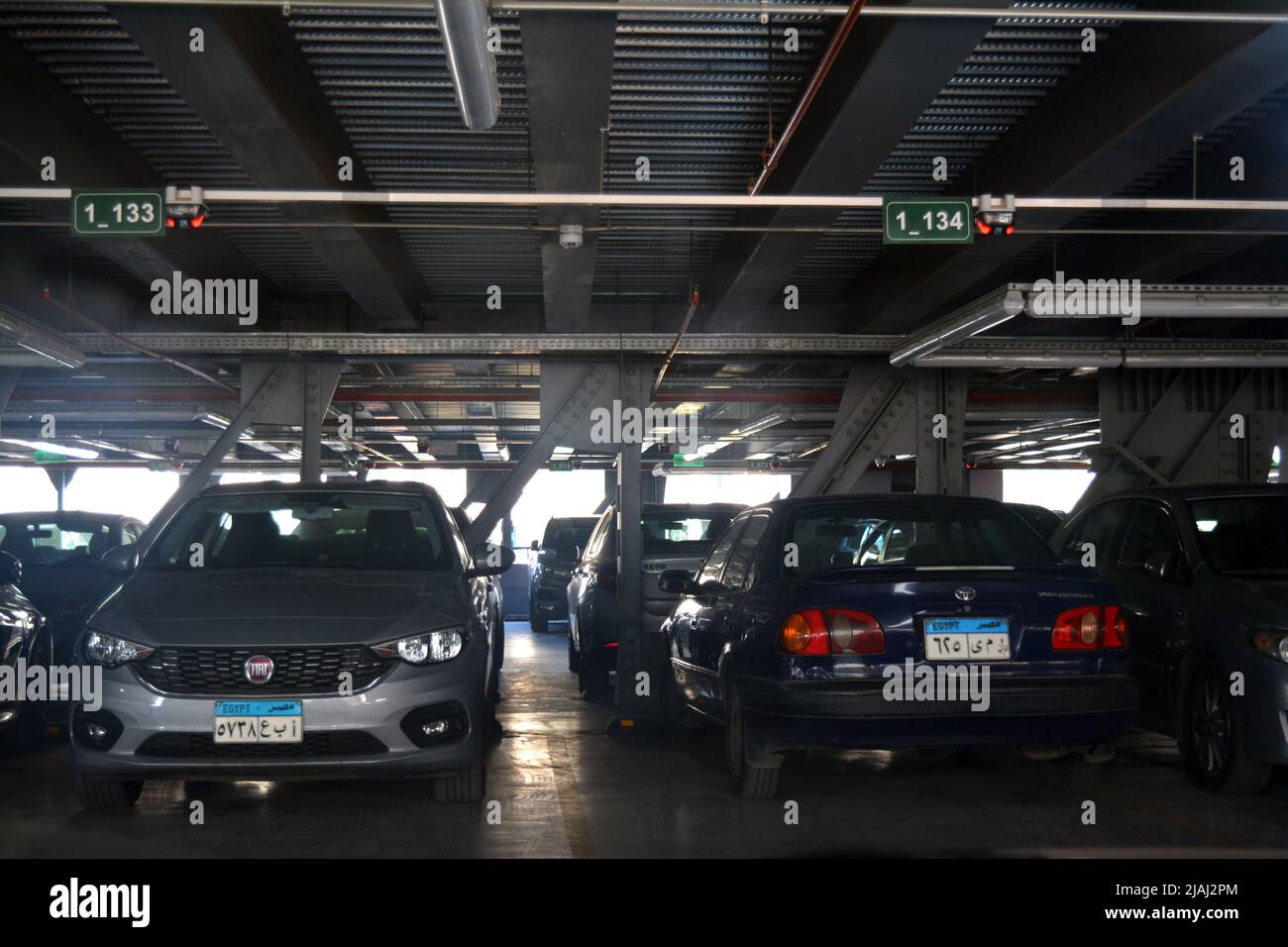 Cairo, Egypt, April 14 2022: Parked cars inside a multilevel parking ...