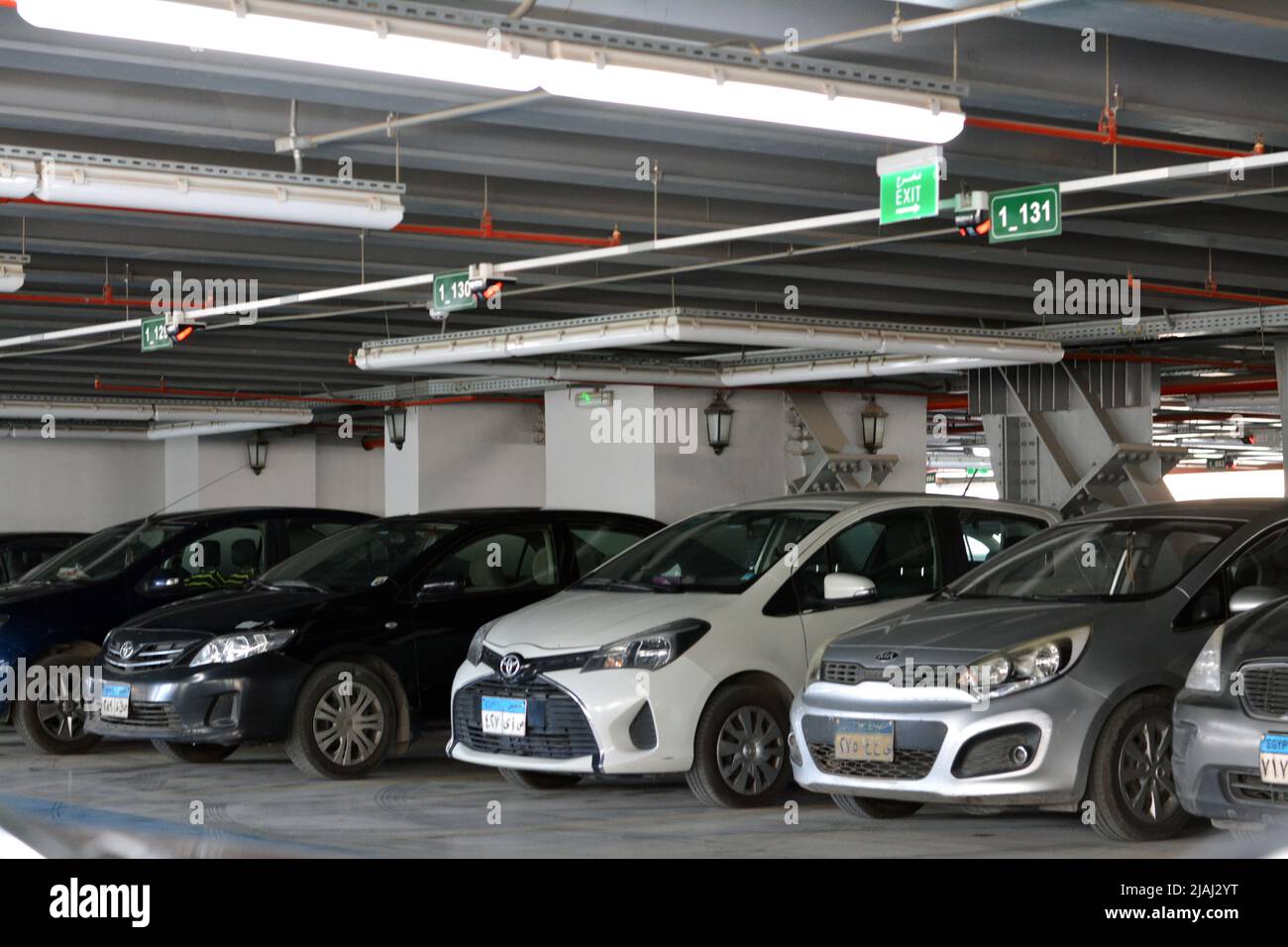 Cairo, Egypt, April 14 2022: Parked cars inside a multilevel parking ...