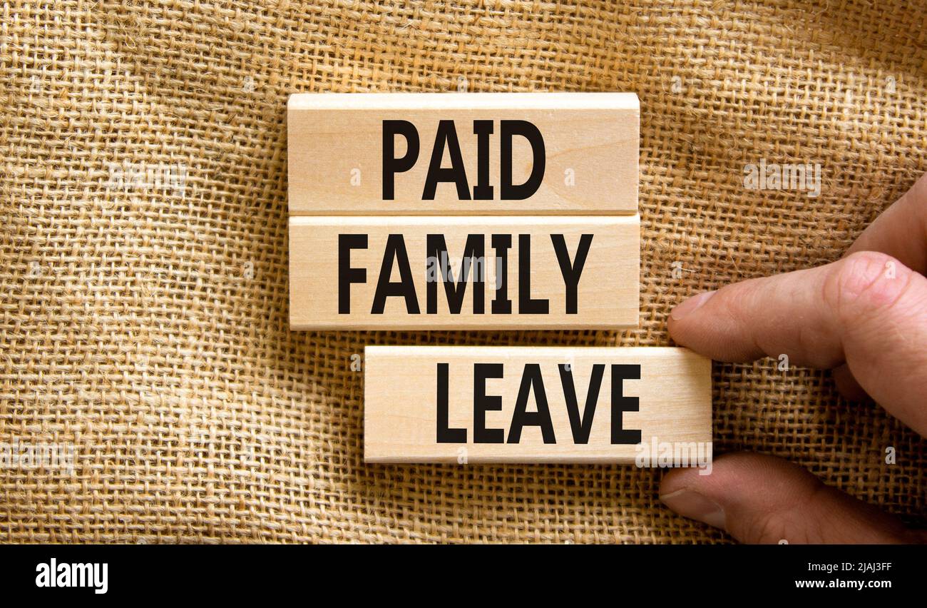 Paid family leave symbol. Concept words Paid family leave on wooden ...