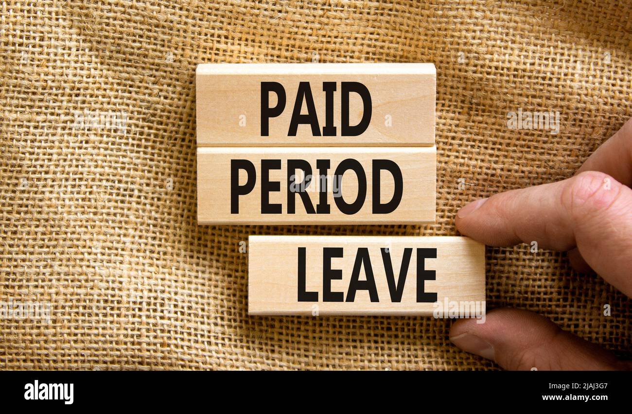 Paid period leave symbol. Concept words Paid period leave on wooden ...