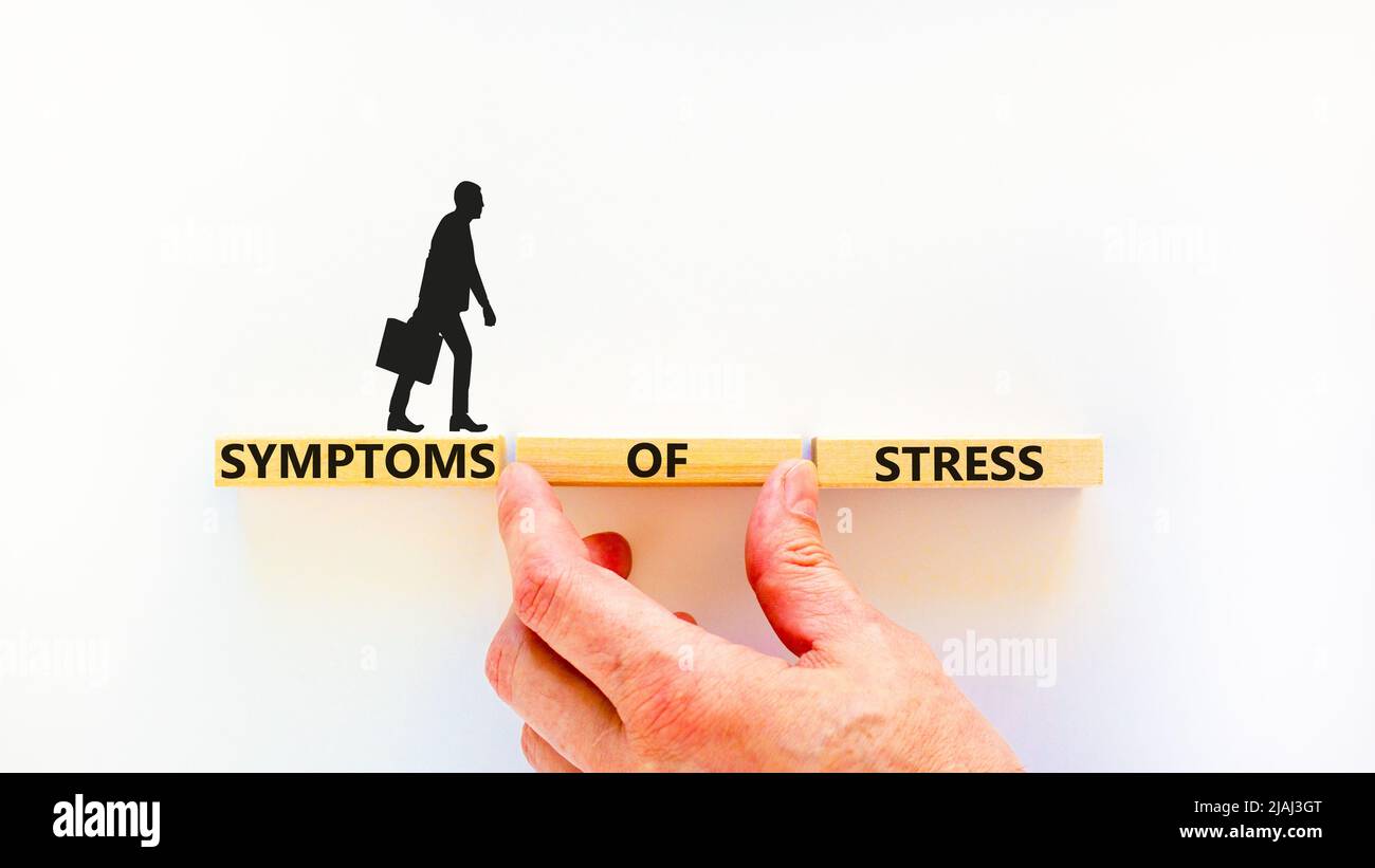 Symptoms of stress symbol. Concept words Symptoms of stress on wooden ...