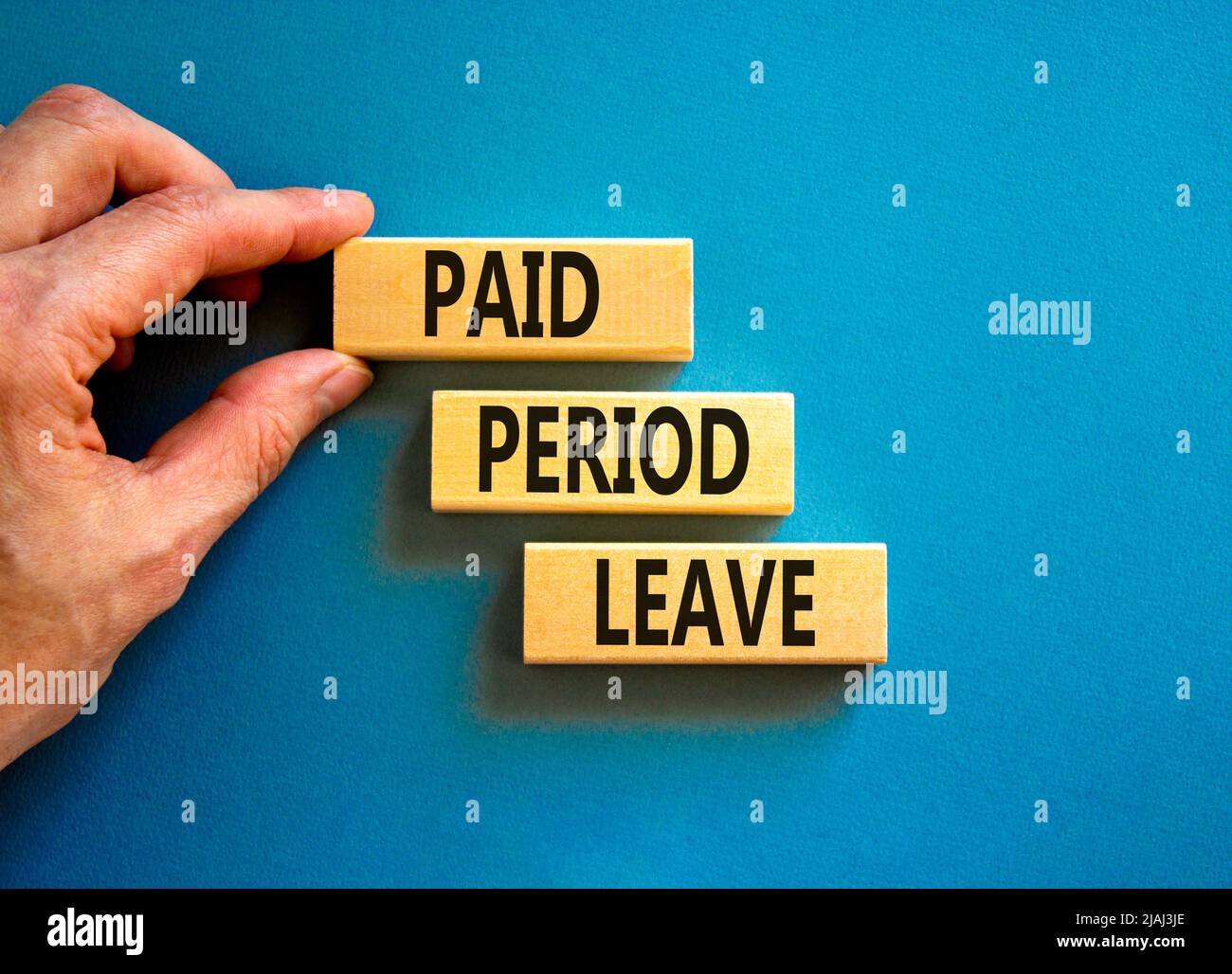 Paid period leave symbol. Concept words Paid period leave on wooden ...