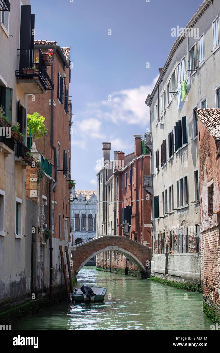 Romantic view on narrow street of Venice with old buildings and bridge ...