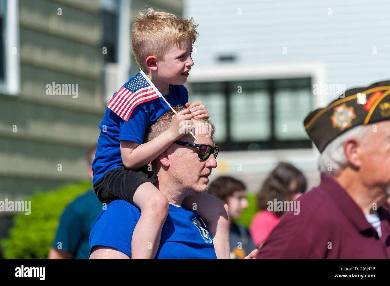 Concord, Massachusetts. 30th May, 2022. Young boy holding a small US ...