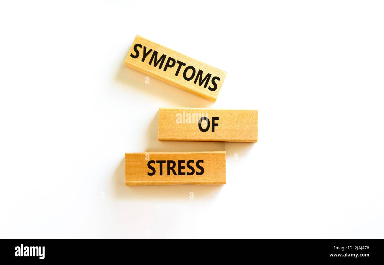 Symptoms of stress symbol. Concept words Symptoms of stress on wooden ...