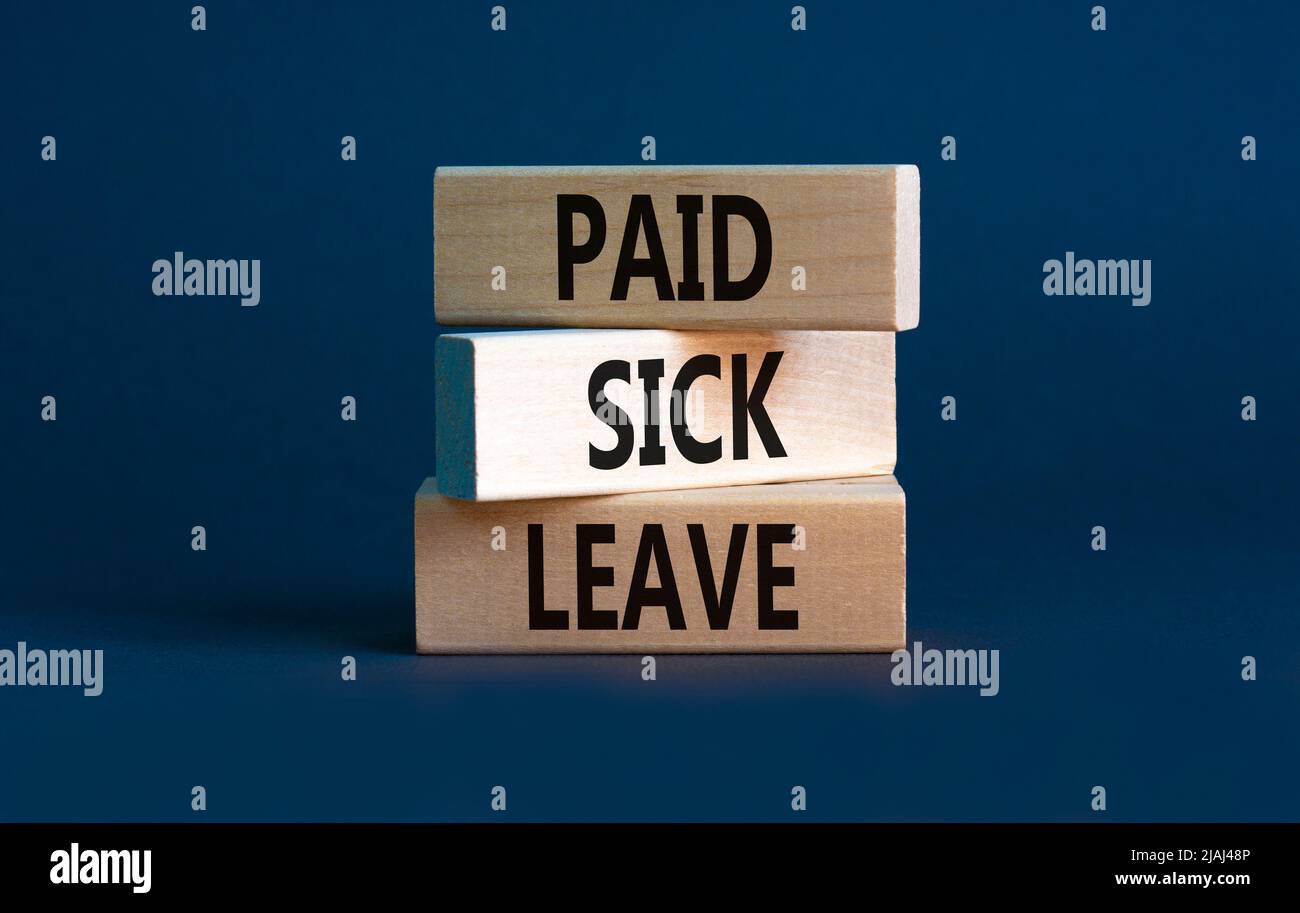 Paid sick leave symbol. Concept words Paid sick leave on wooden blocks ...