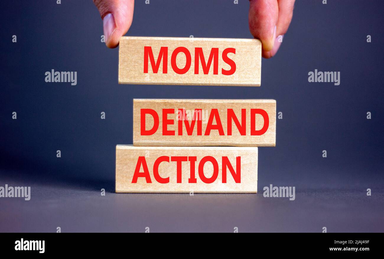 Moms demand action symbol. Concept words Moms demand action on wooden ...