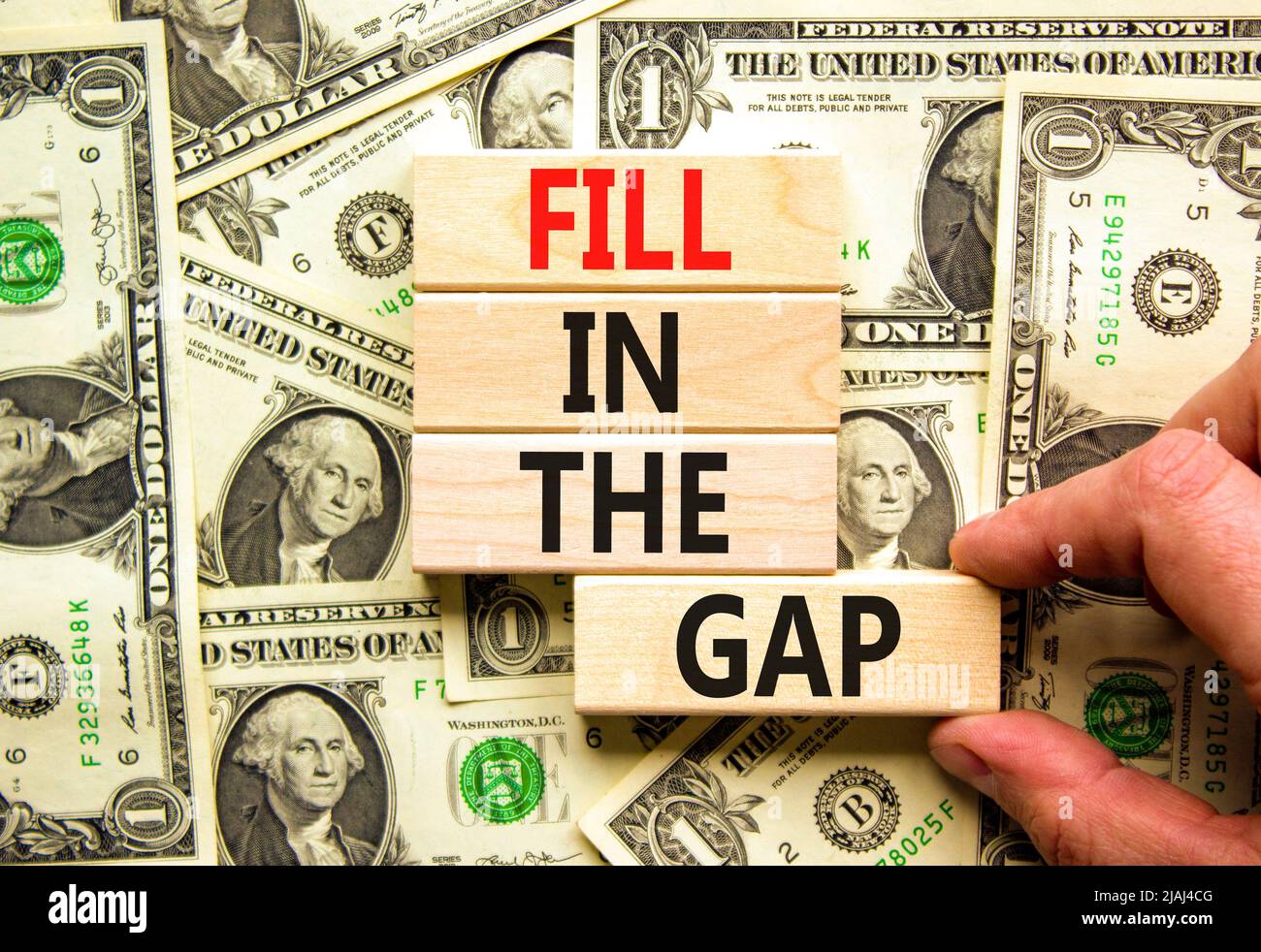 Fill in the gap symbol. Concept words Fill in the gap on wooden blocks on a beautiful background ...