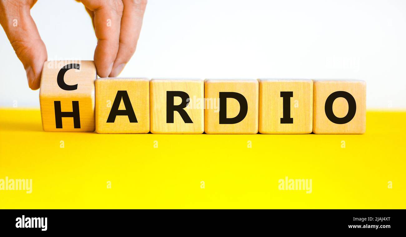 Cardio or hardio symbol. Businessman turns wooden cubes and changes ...