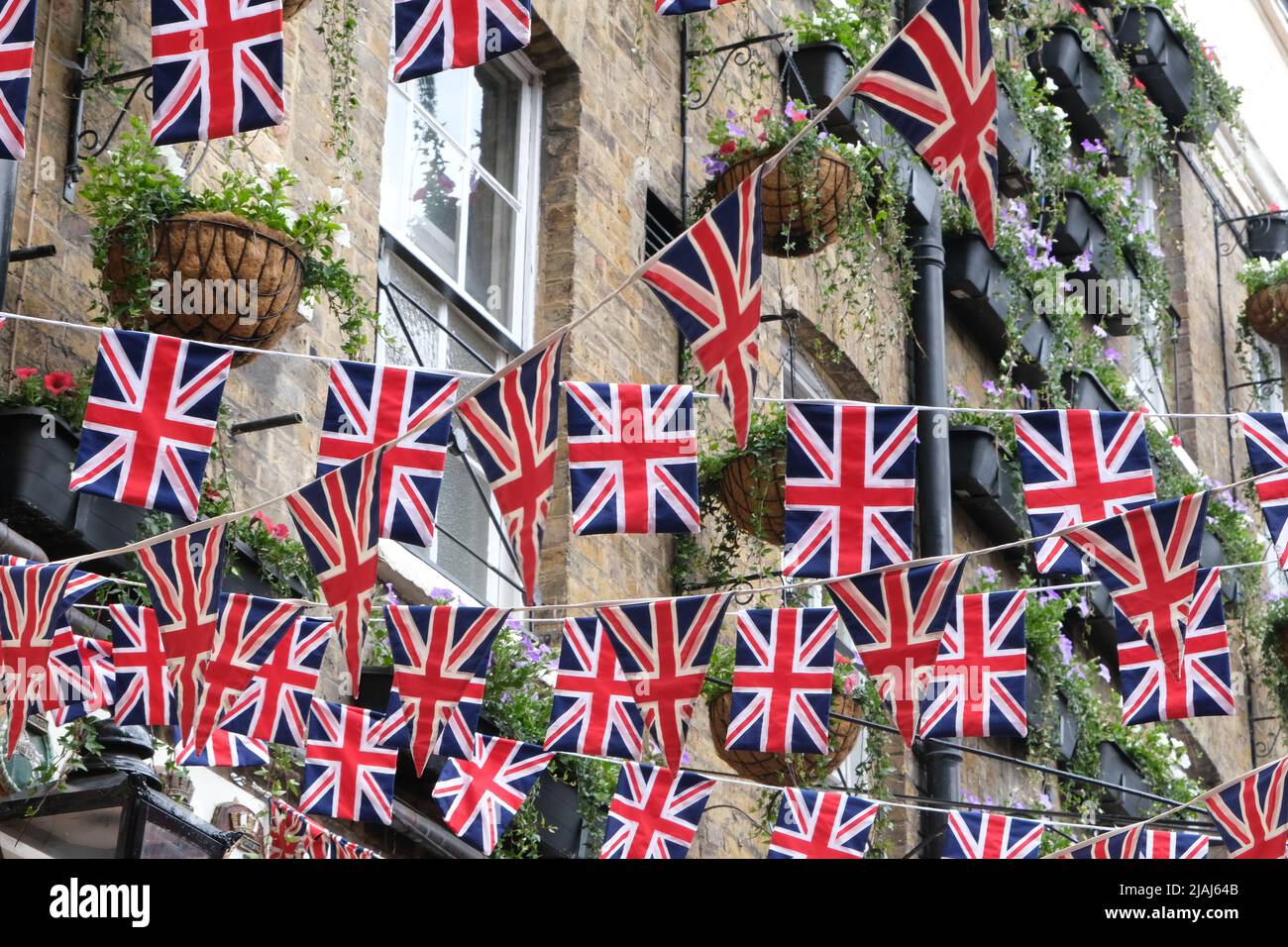 British flags hanging on the streets of London. Union jack flag ...