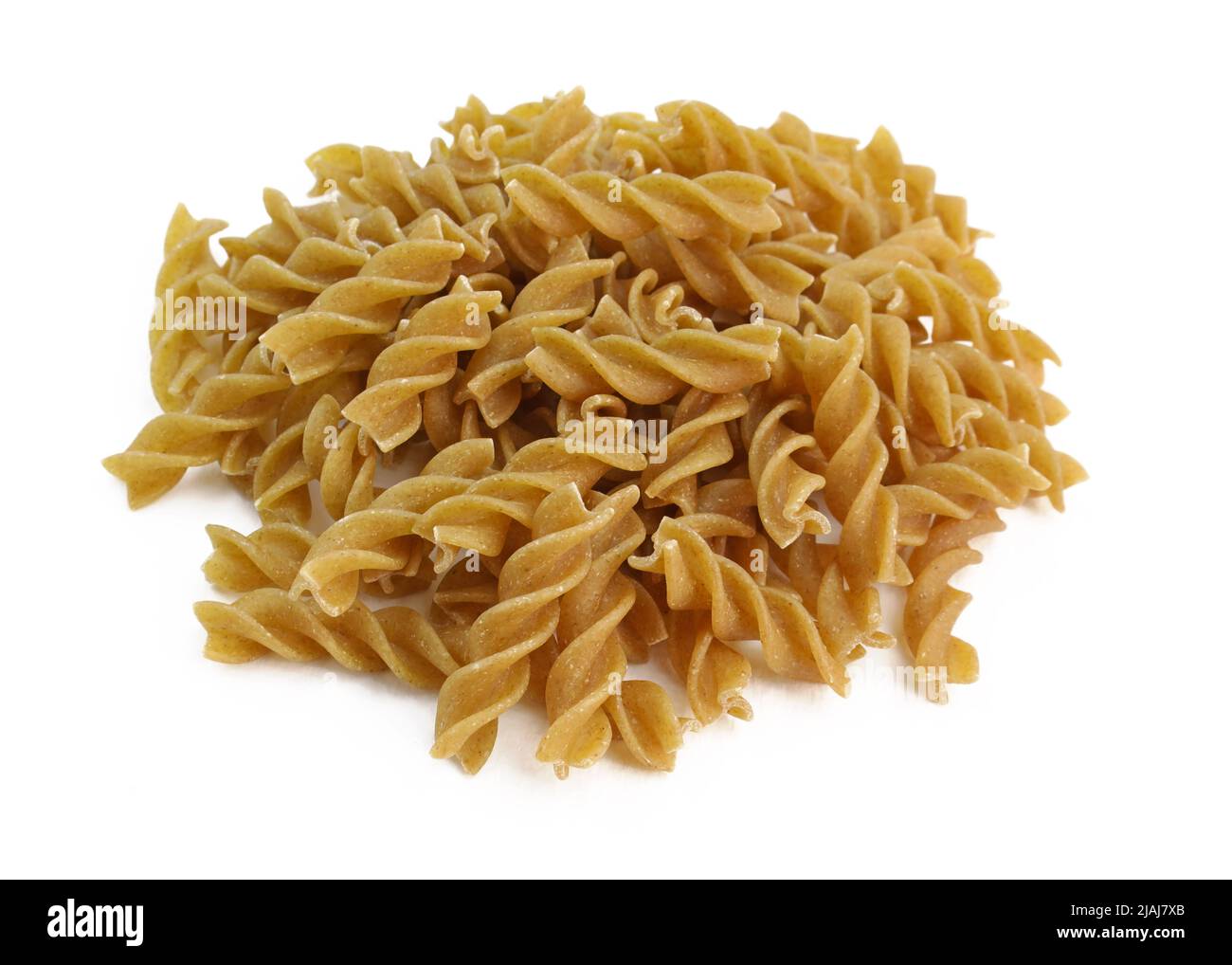 Organic wholemeal rye spiral pasta. Brown durum macaroni on a white ...