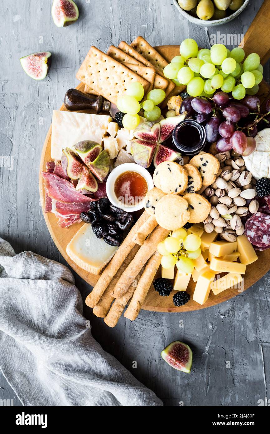 Charcuterie board. Cheese platter: Parmesan, maasdam, camembert ...