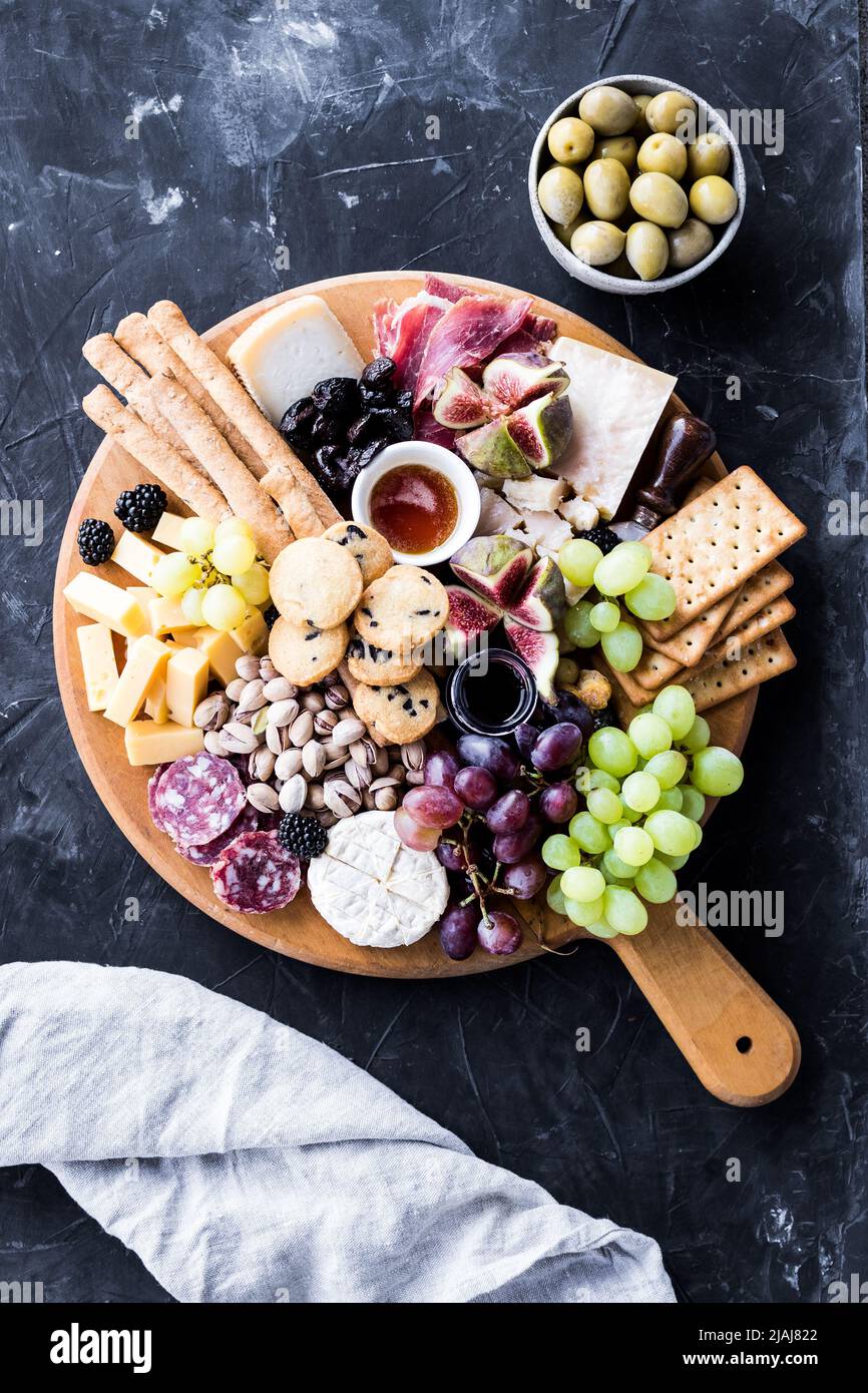 Charcuterie board. Cheese platter: Parmesan, maasdam, camembert ...