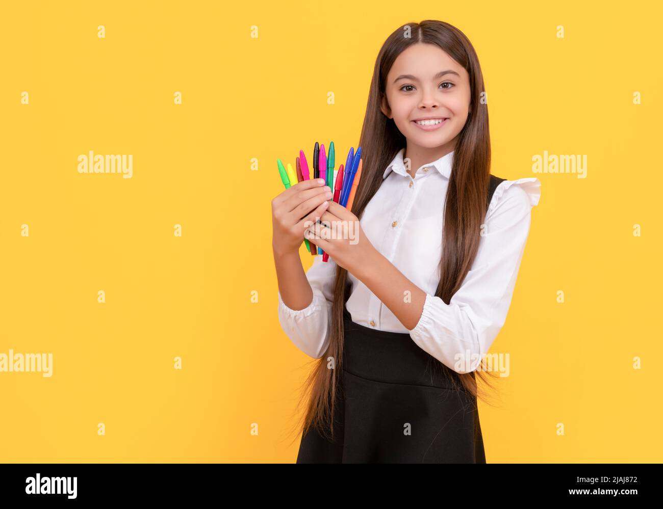 Back to school supplies. Happy kid hold felt-tip pens. Back to school ...
