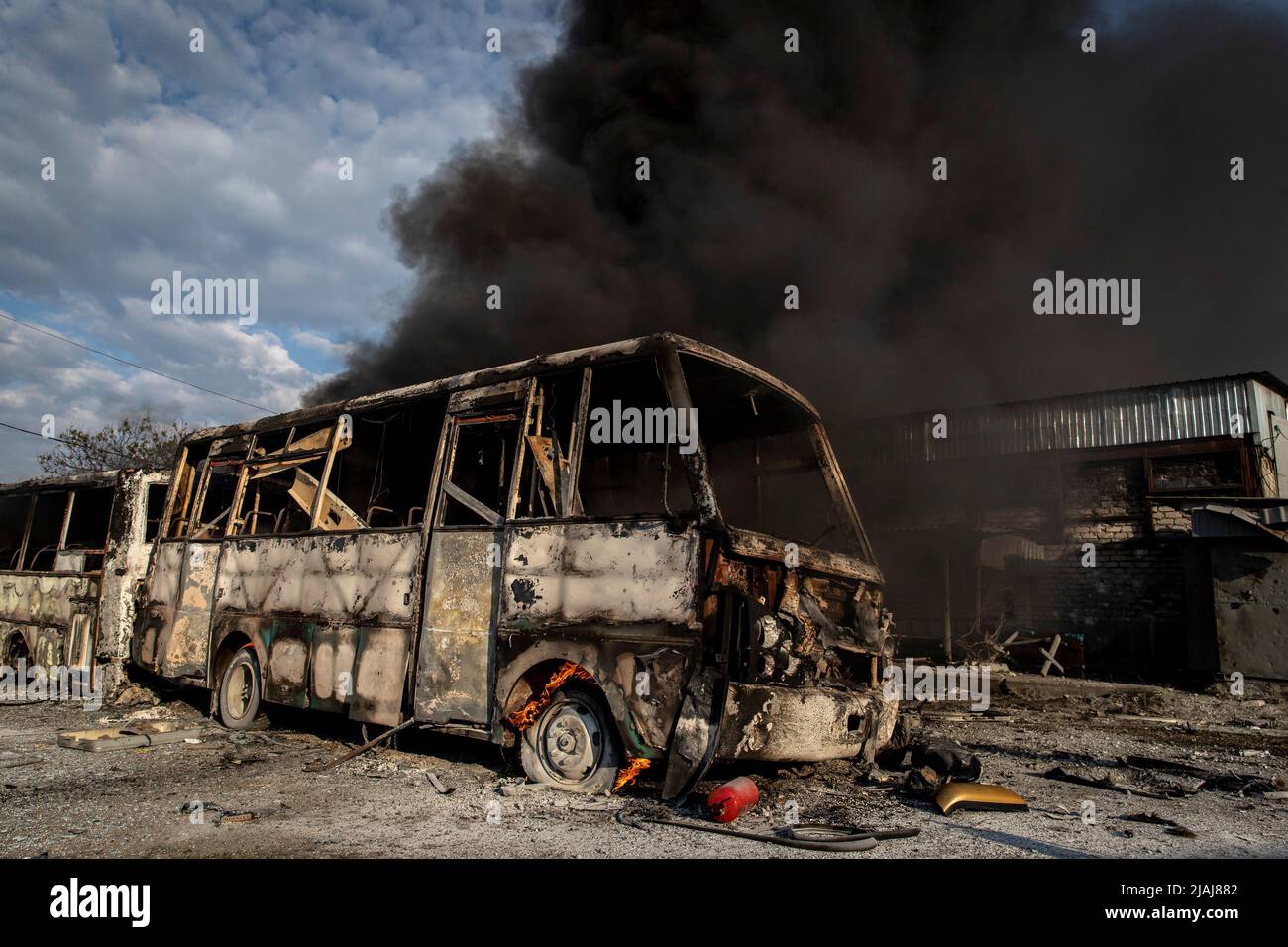 Lysychansk, Ukraine. 28th May, 2022. A destroyed bus can be seen in a ...
