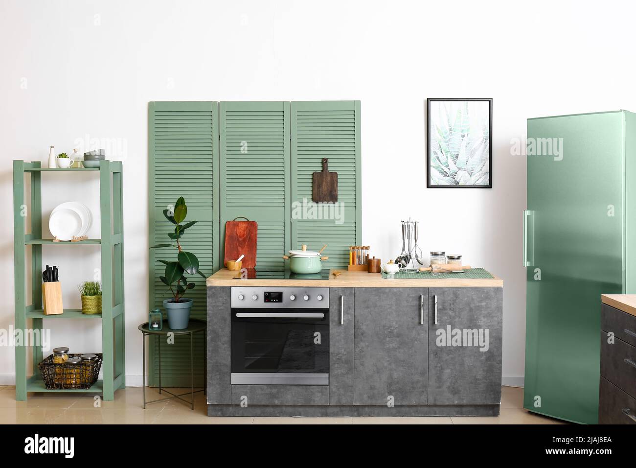 Modern interior of comfortable kitchen with fridge, oven and folding ...