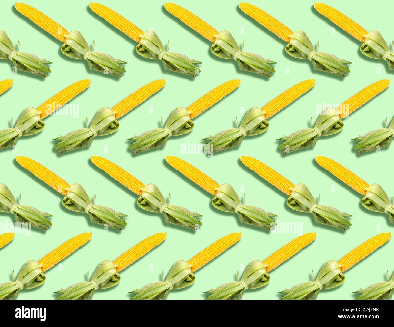 Many fresh corn cobs on green background. Pattern for design Stock ...