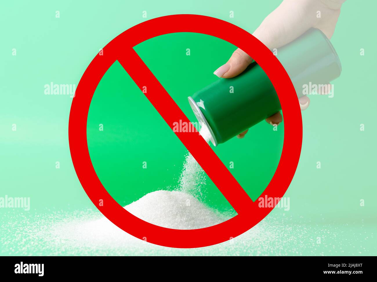 Woman pouring sugar from tin can and prohibition sign on green ...