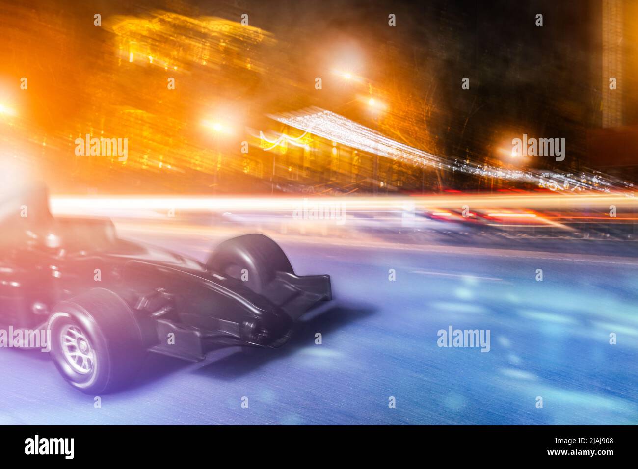 Fast racing car on night city street Stock Photo - Alamy
