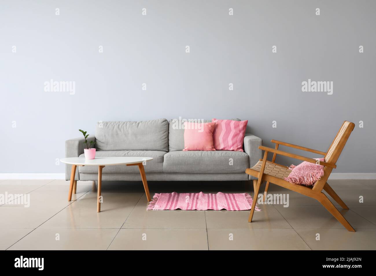 Interior of stylish living room with modern armchair, table and sofa ...