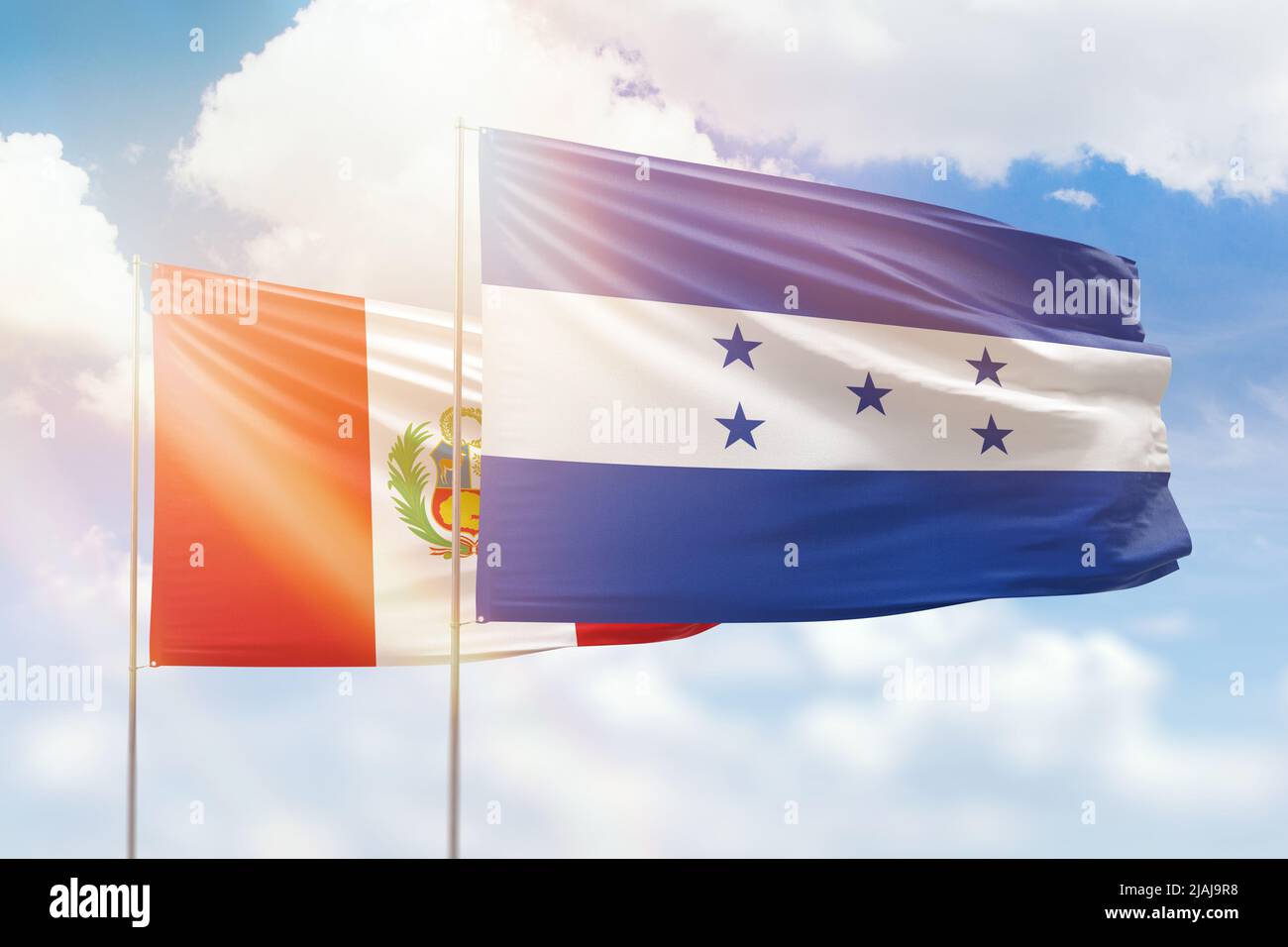 Sunny blue sky and flags of honduras and peru Stock Photo - Alamy