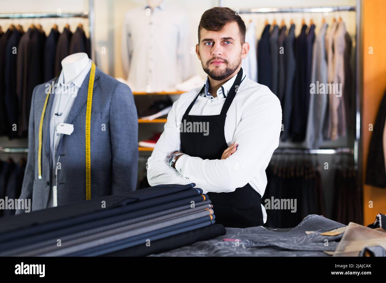 Male tailor posing in workshop Stock Photo - Alamy