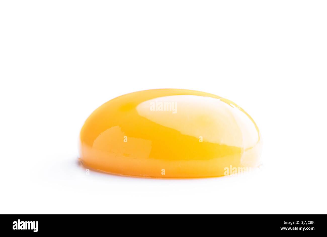 Egg yolk closeup isolated on white background Stock Photo - Alamy