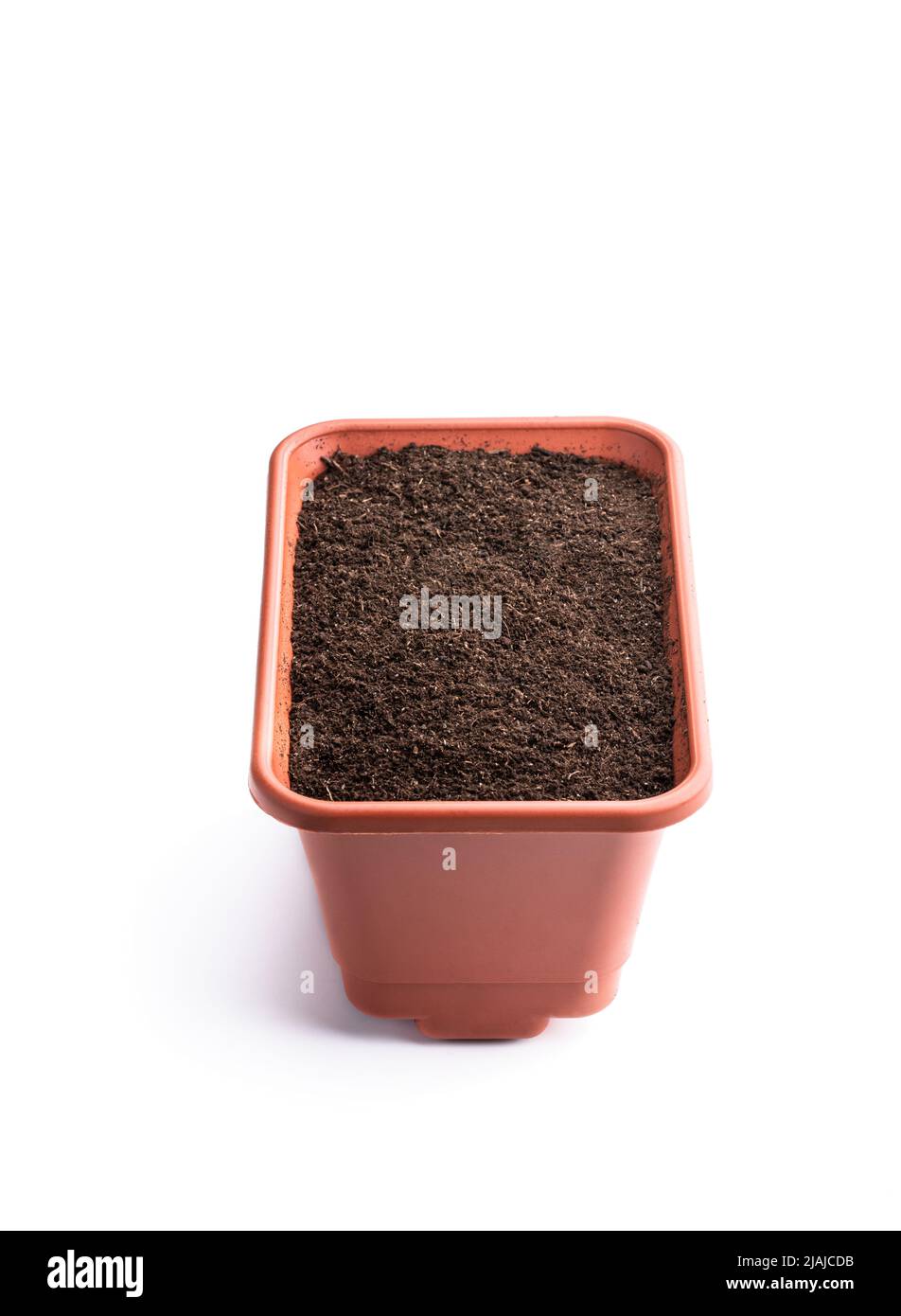 Rectangular pot filled with organic potting soil isolated on white ...
