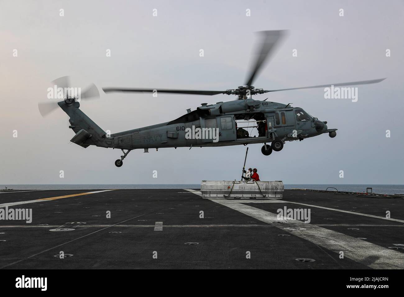 PHILIPPINE SEA (May 20, 2022) Rear Adm. J.T. Anderson, left, commander ...