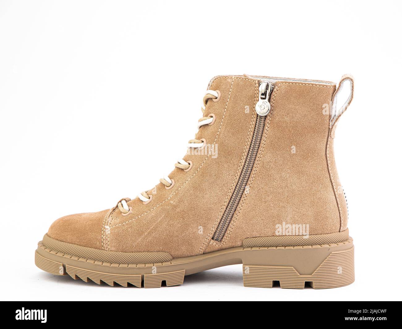 Beige suede boots with beige laces and zipper on the side. Elasticated ...