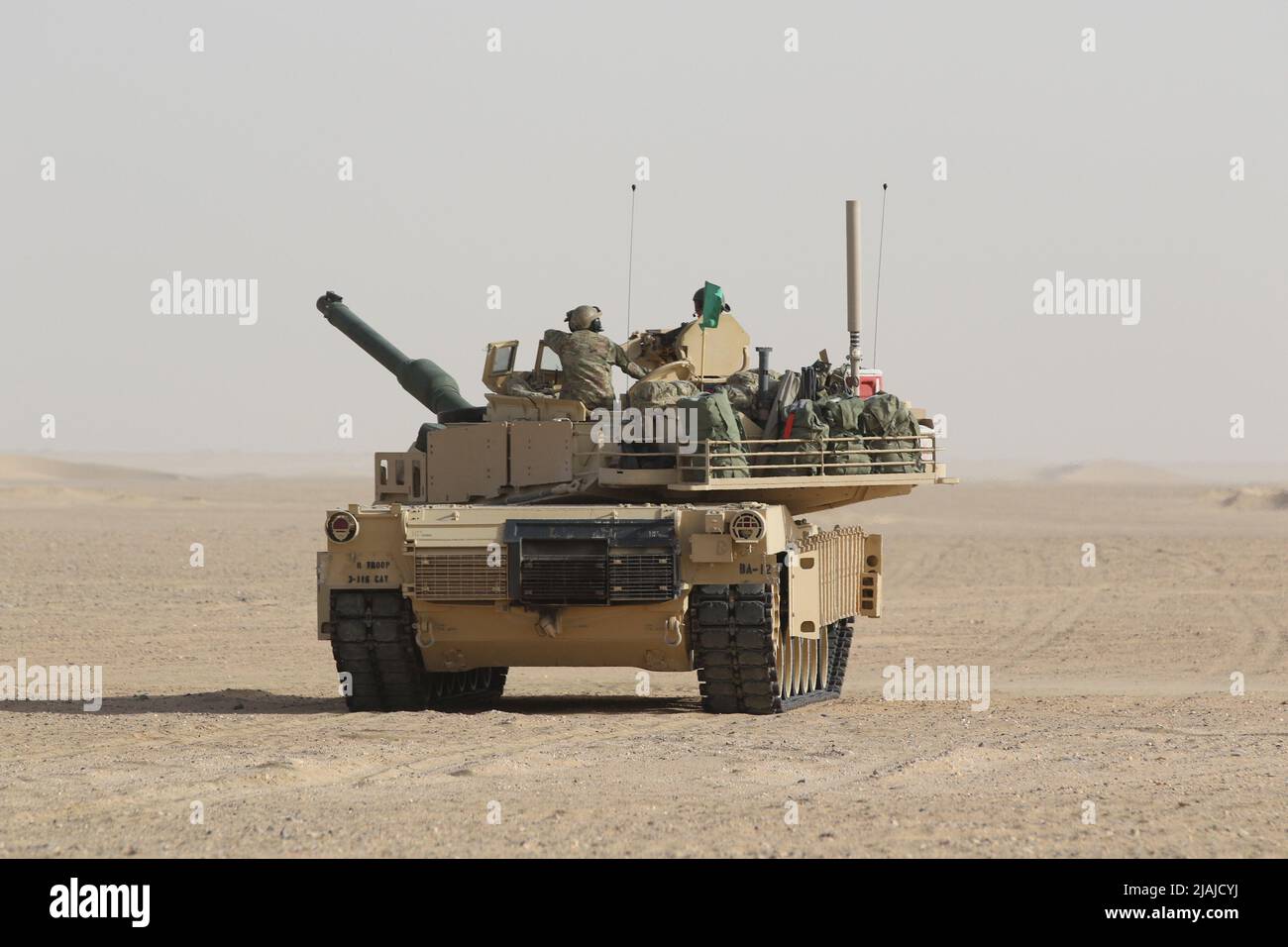 An M1 Abrams tank raises its barrel to show its safe during a Combined ...