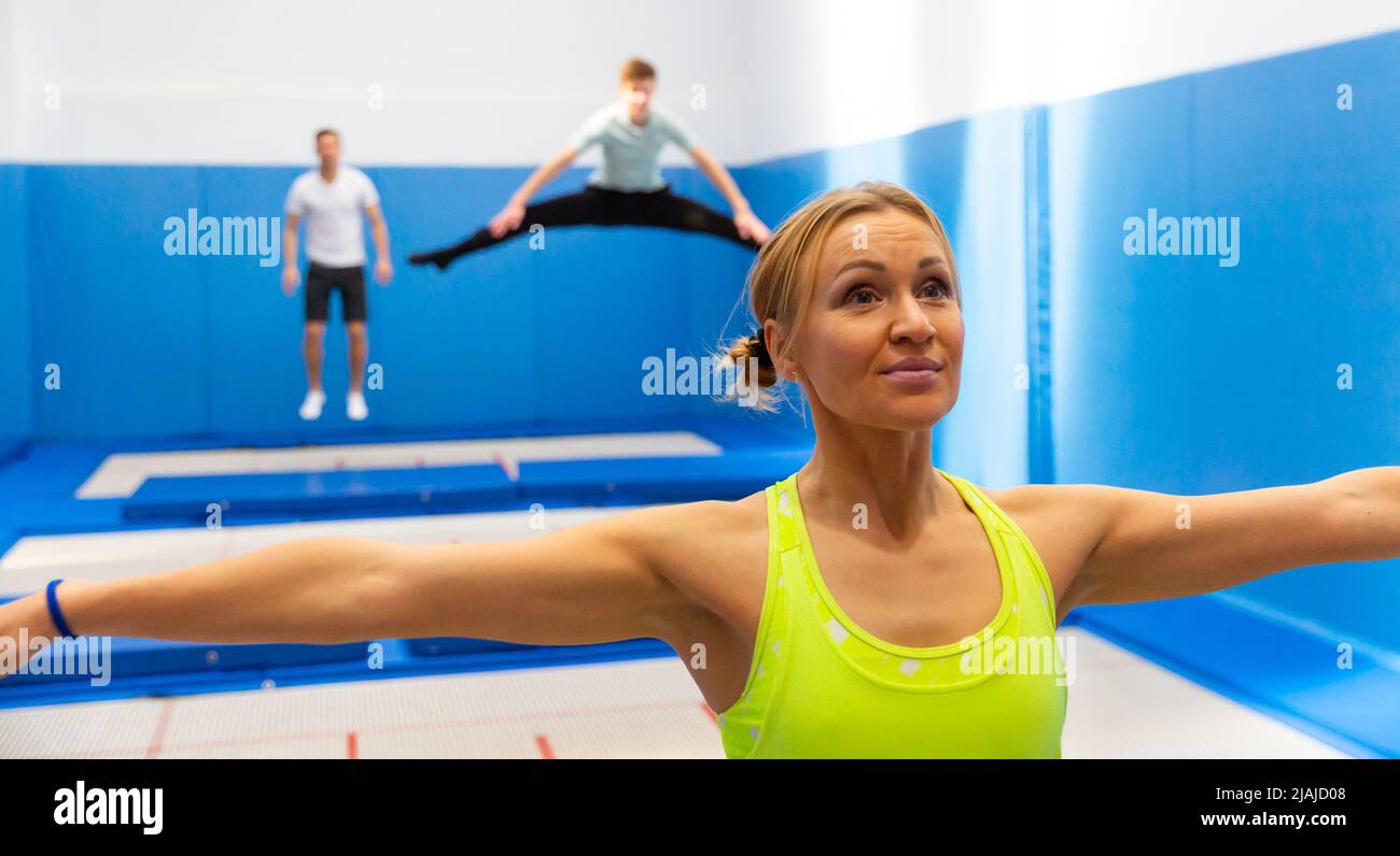 Close up female gymnast during training on trampoline Stock Photo - Alamy