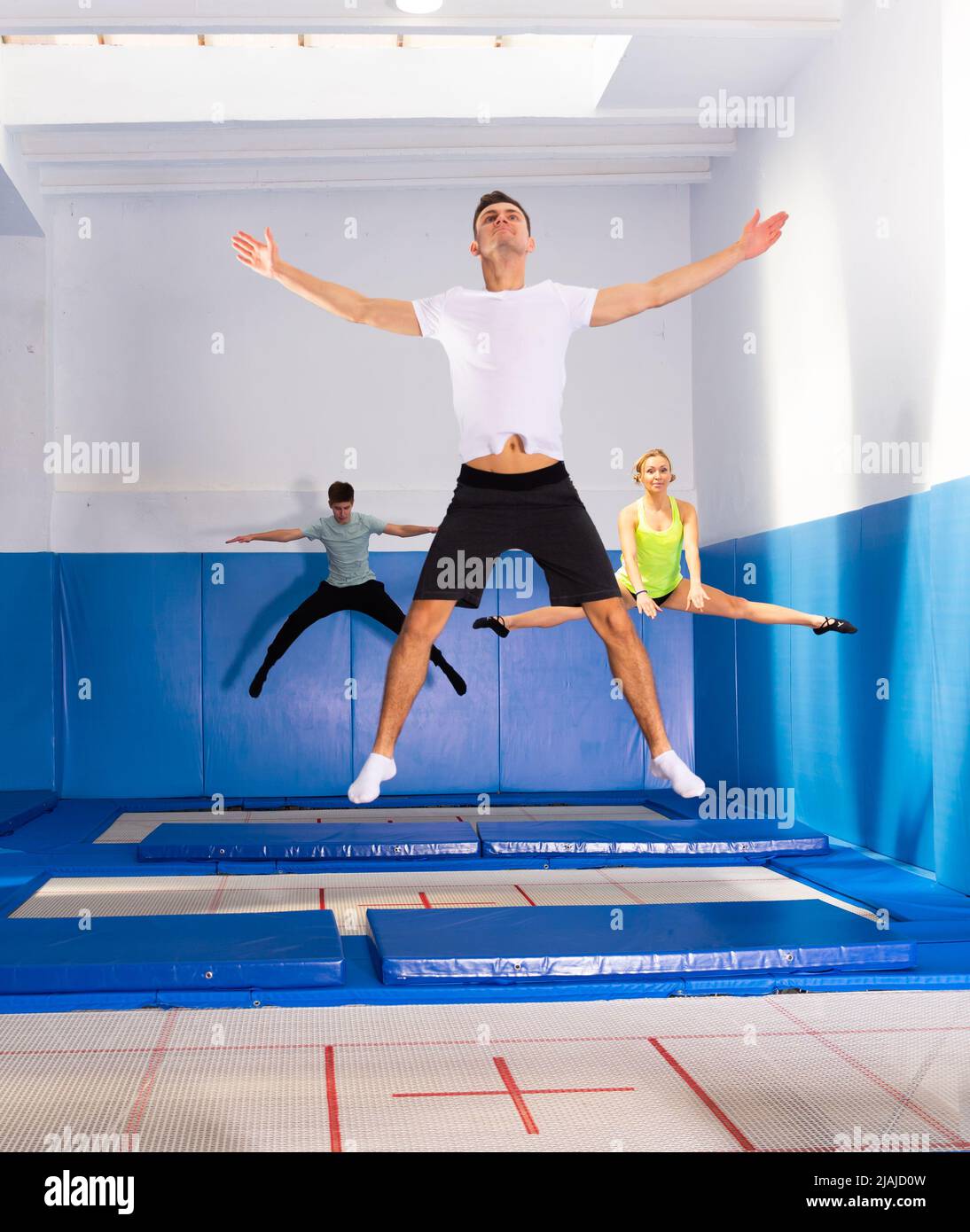 People jumping in trampoline center Stock Photo - Alamy