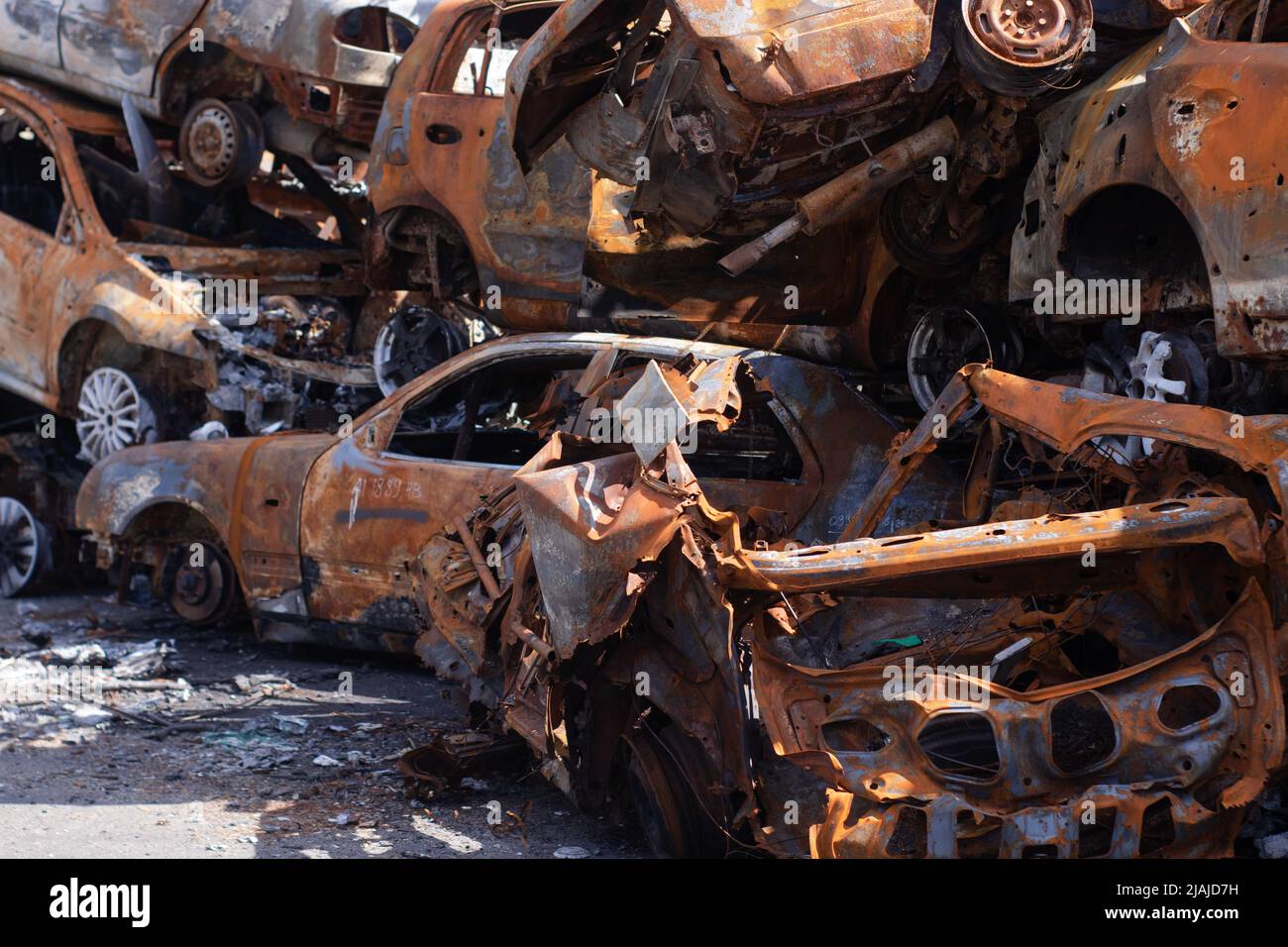 war in ukraine. Car graveyard. Shot cars of civilians. russia's war ...