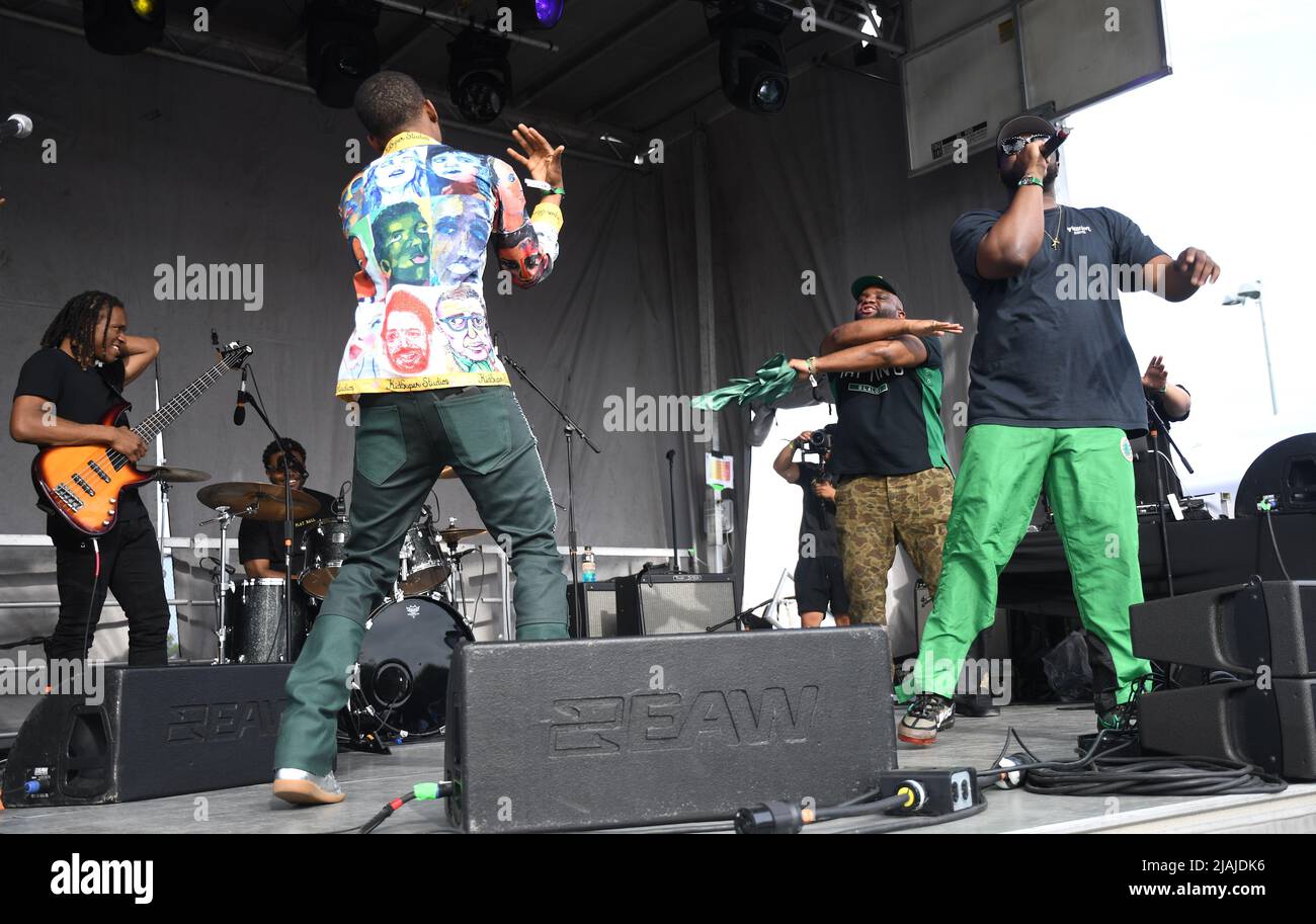 Rapper Avenue is shown performing on stage during a live concert ...