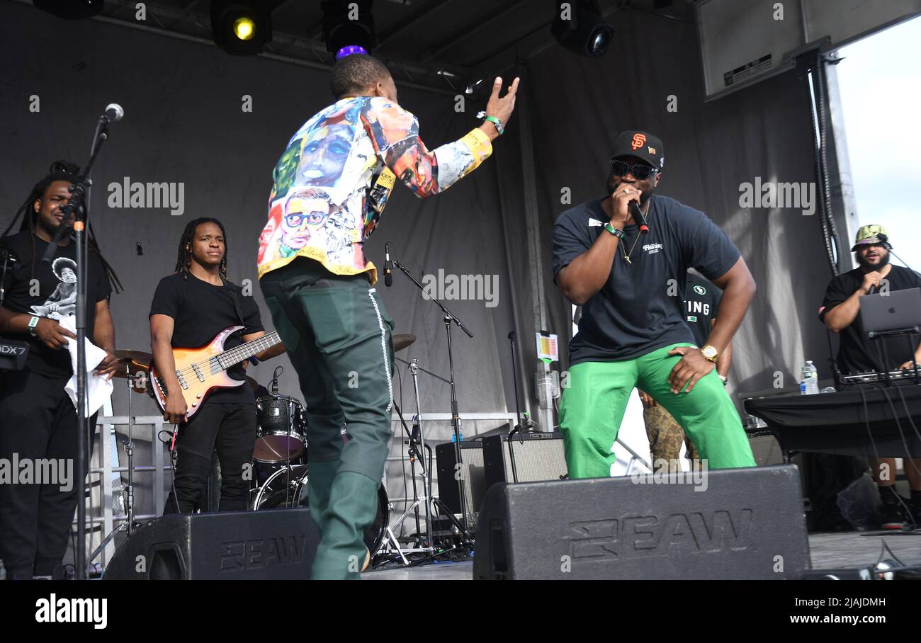 Rapper Avenue is shown performing on stage during a live concert ...