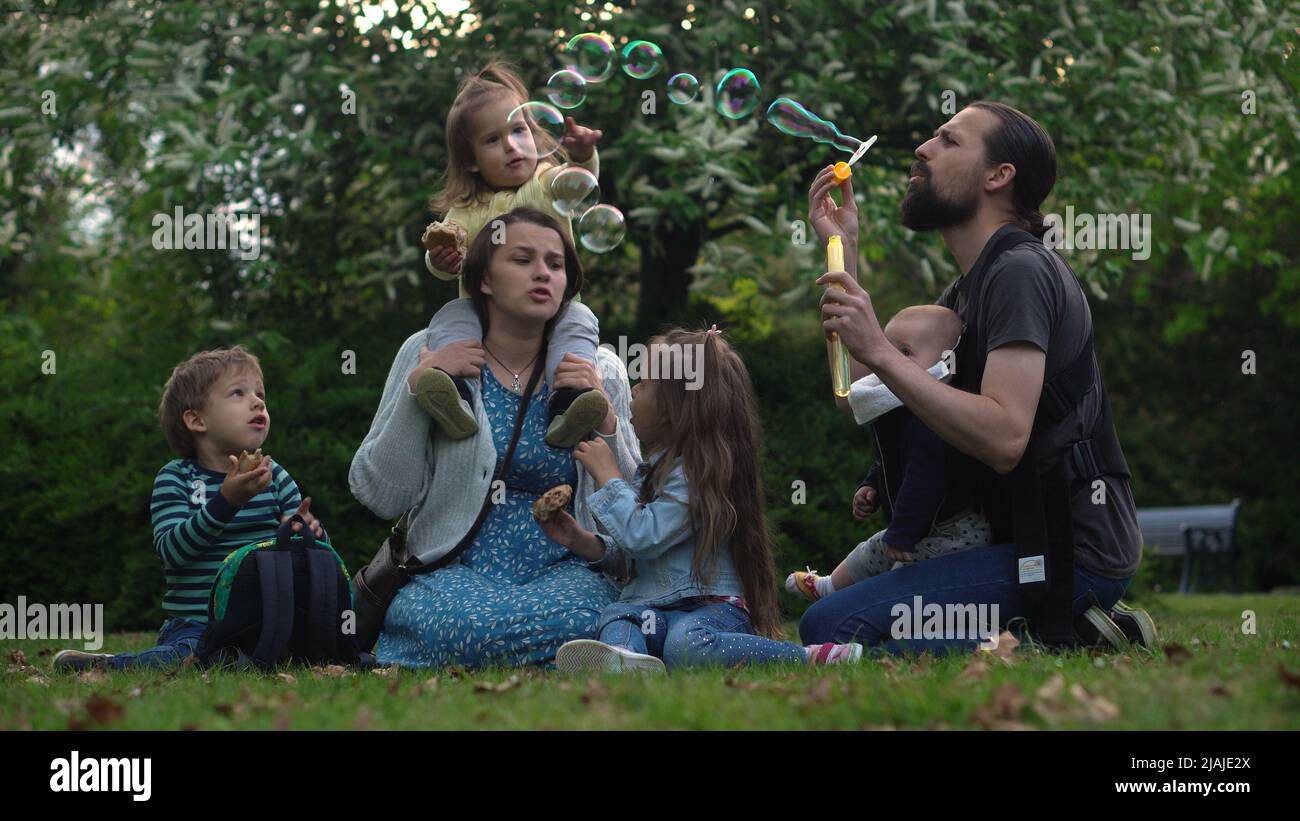 Happy family mother Father Three four Baby little siblings kids have ...