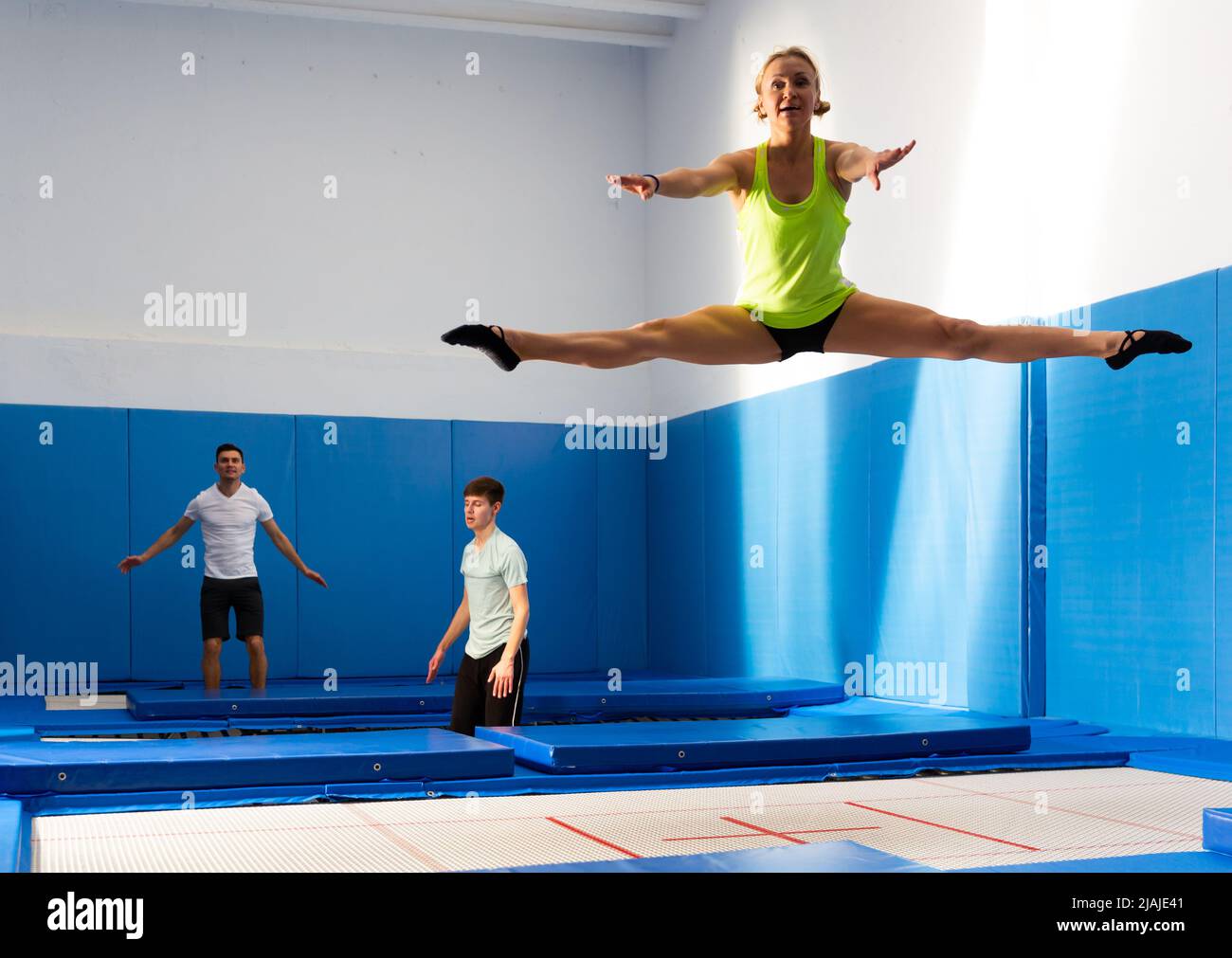 Aerial jumping young woman hi-res stock photography and images - Alamy