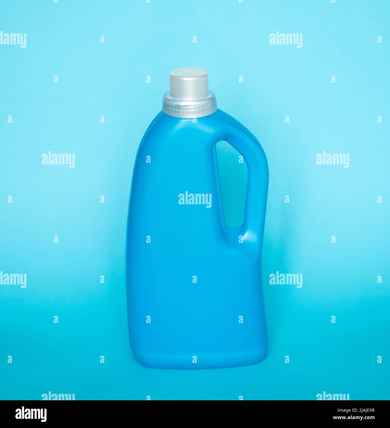Big Blue plastic bottles of cleaning products isolated on blue ...