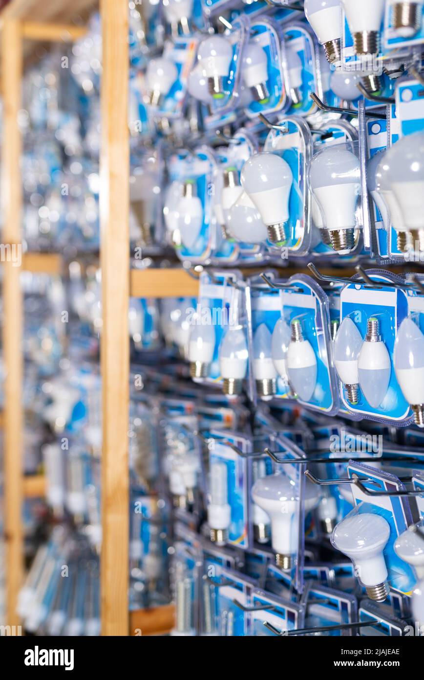 Light bulbs on display stand in household goods store Stock Photo - Alamy