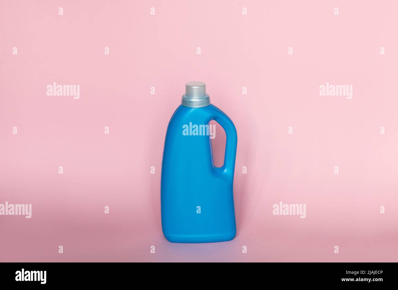 Blue plastic liquid detergent bottle isolated on pink background ...
