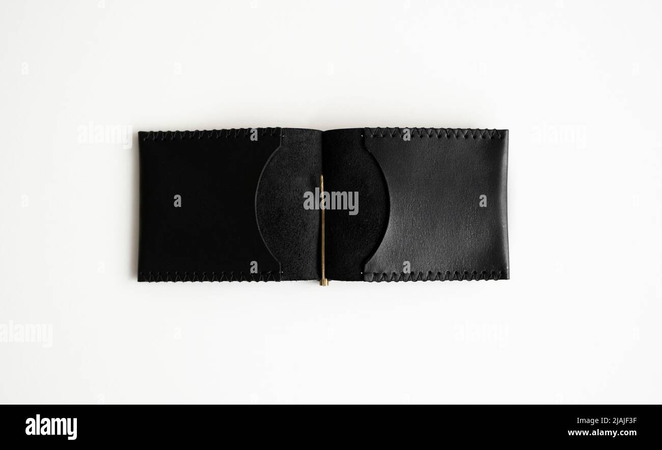 Open black men's money clip handmade leather wallet. Close up. Empty ...