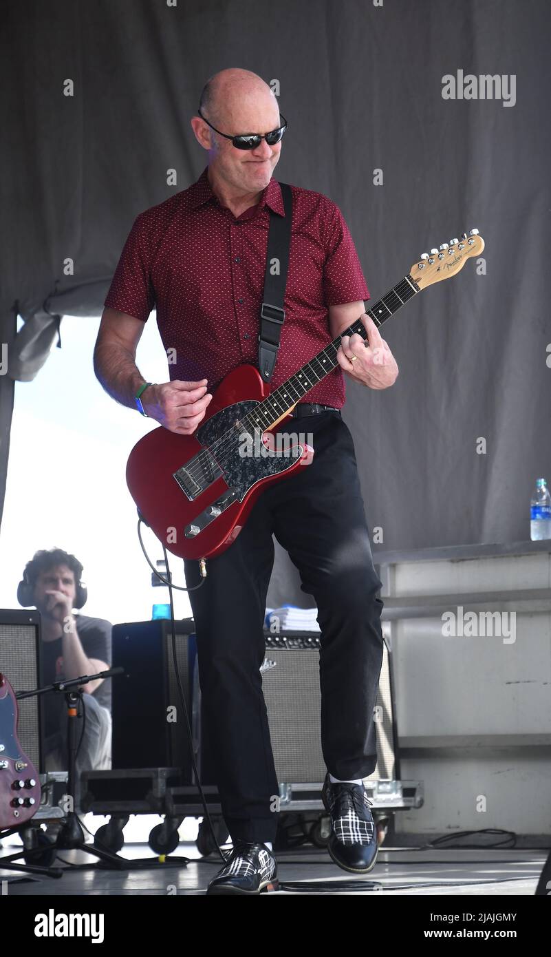 Lead guitarist Tim Gillis is shown performing on stage during a live ...