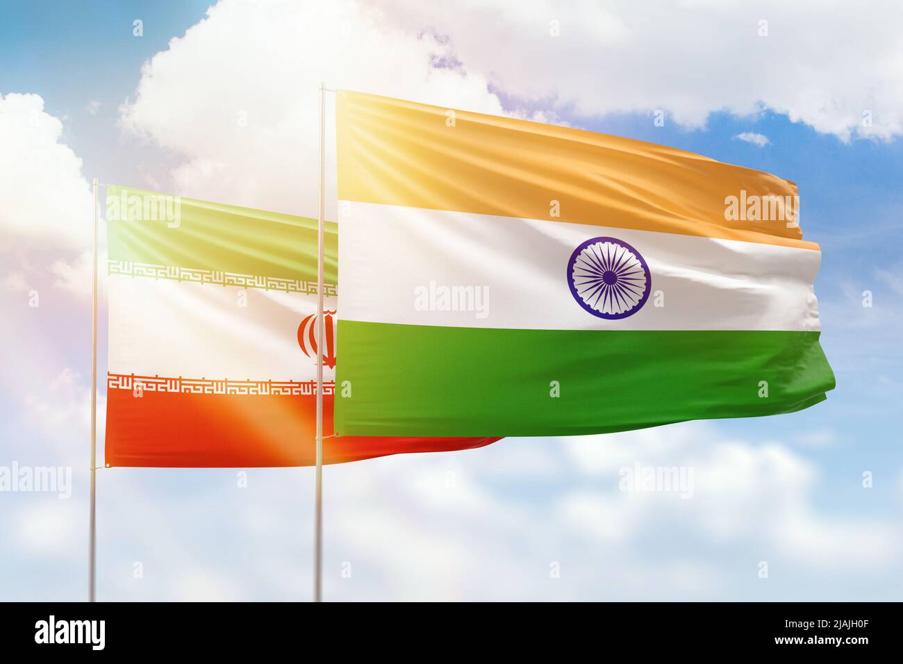 Sunny blue sky and flags of india and iran Stock Photo - Alamy