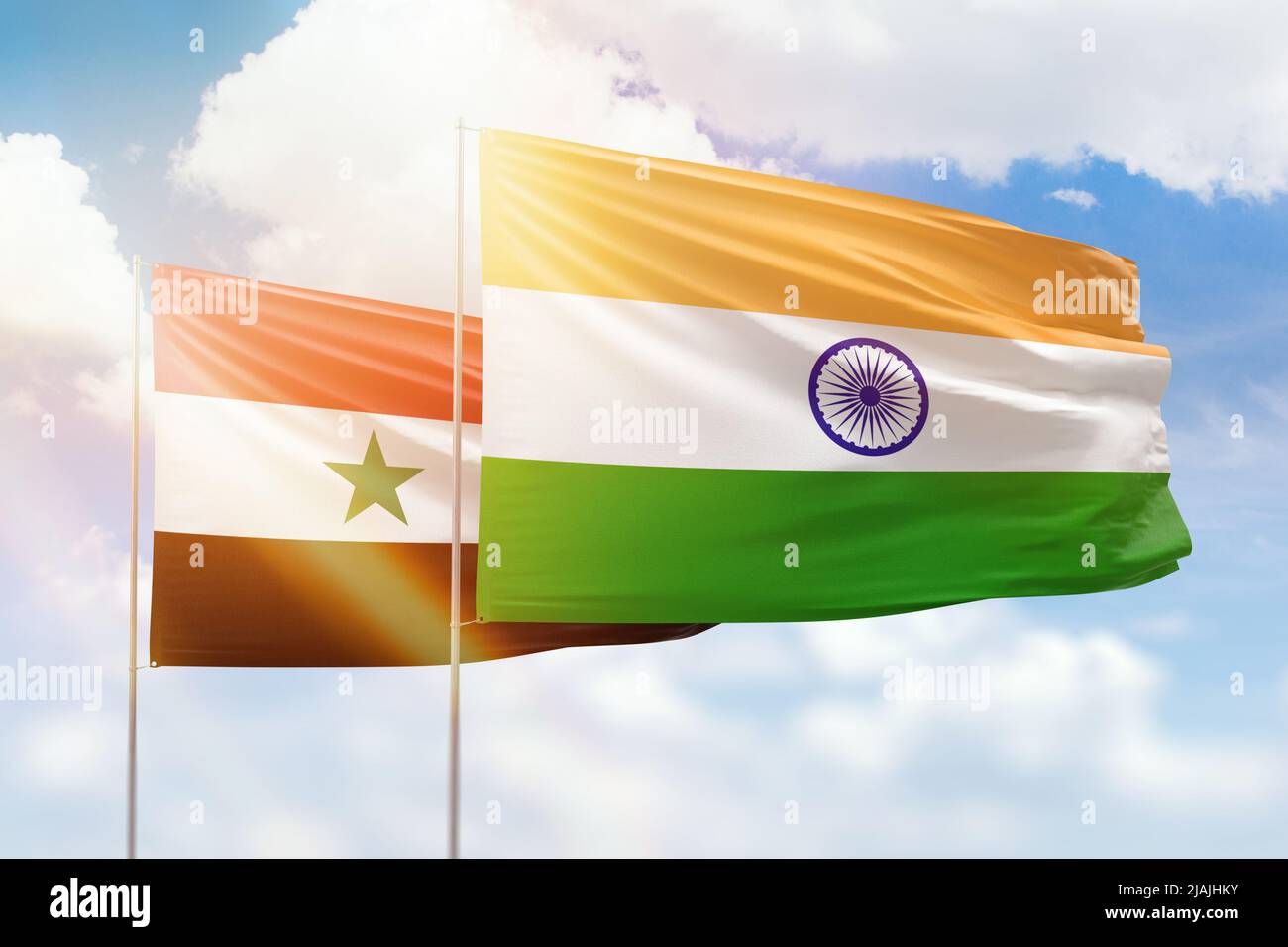 Sunny blue sky and flags of india and syria Stock Photo - Alamy