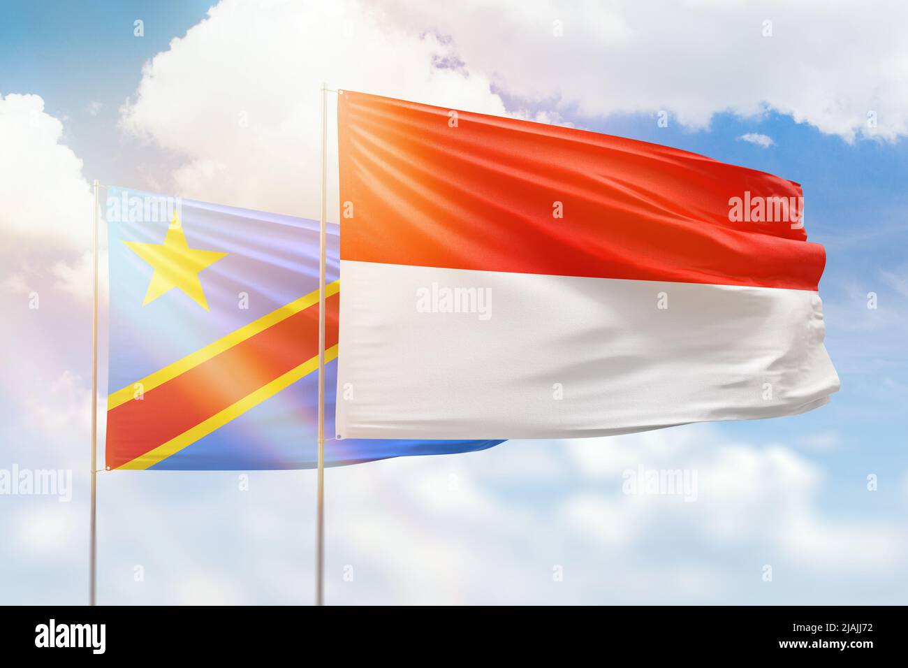 Sunny blue sky and flags of indonesia and dr congo Stock Photo - Alamy