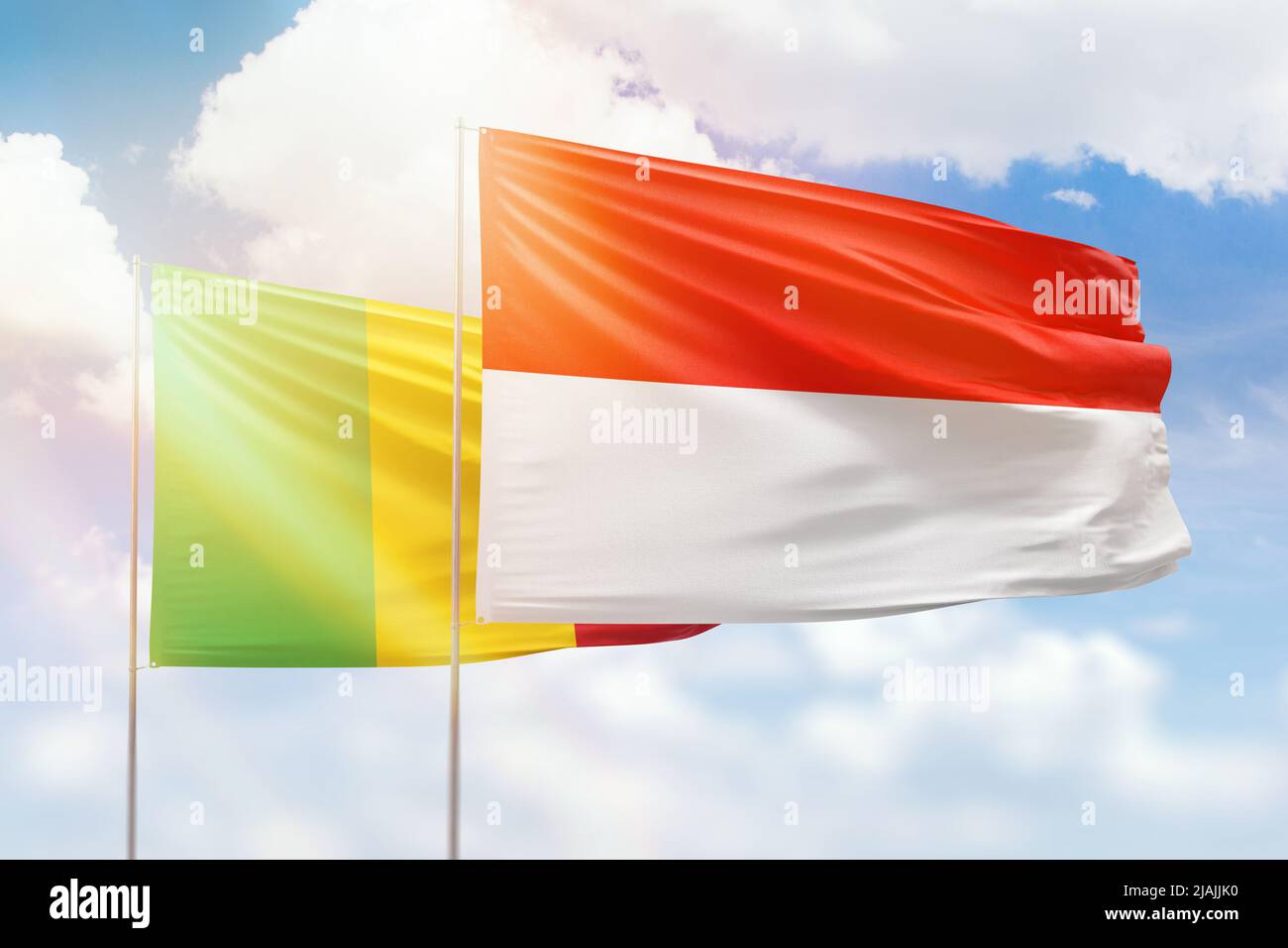 Sunny blue sky and flags of indonesia and mali Stock Photo - Alamy