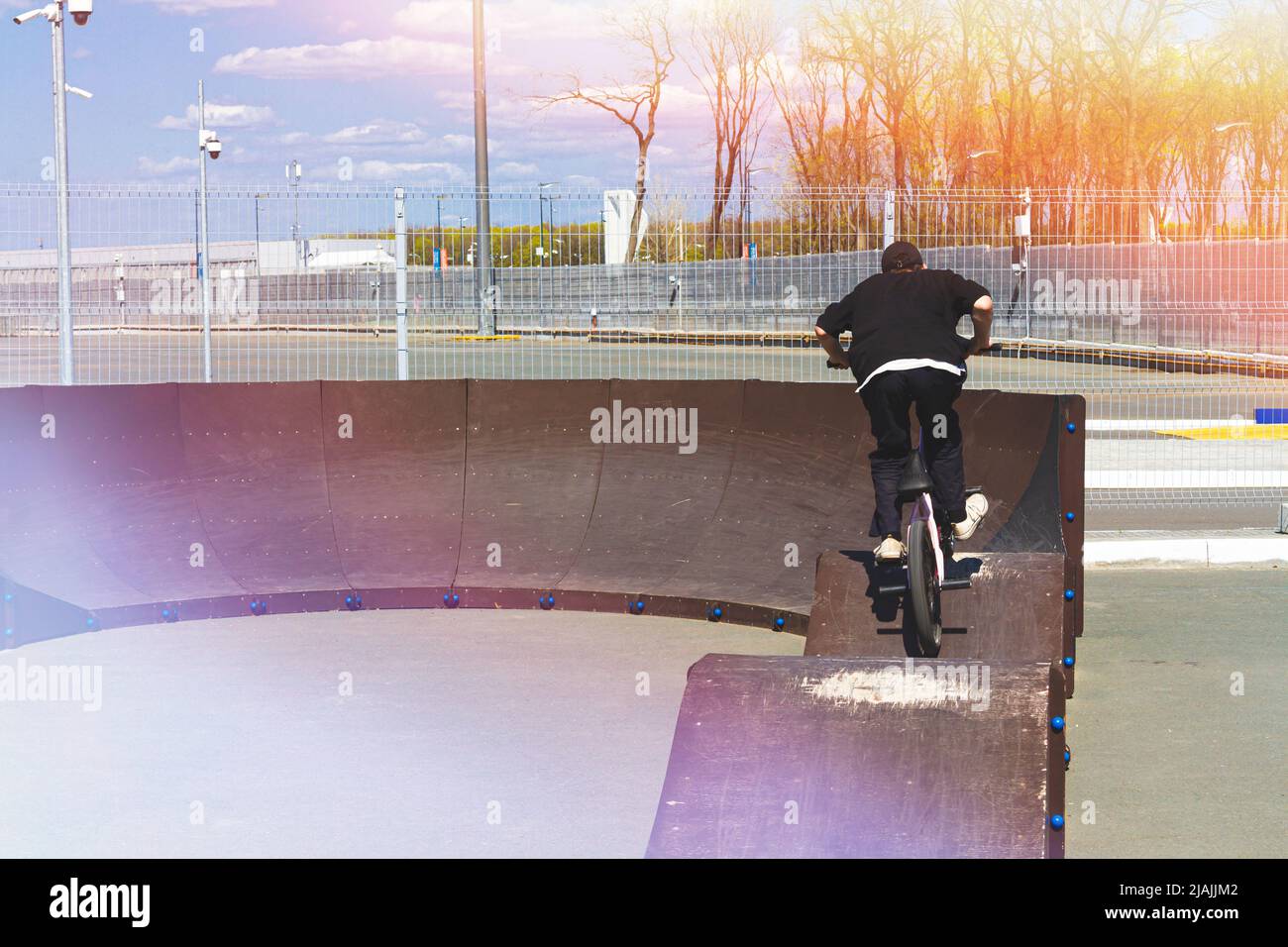 Cycling on the track. The cyclist rides on the hills of the track ...