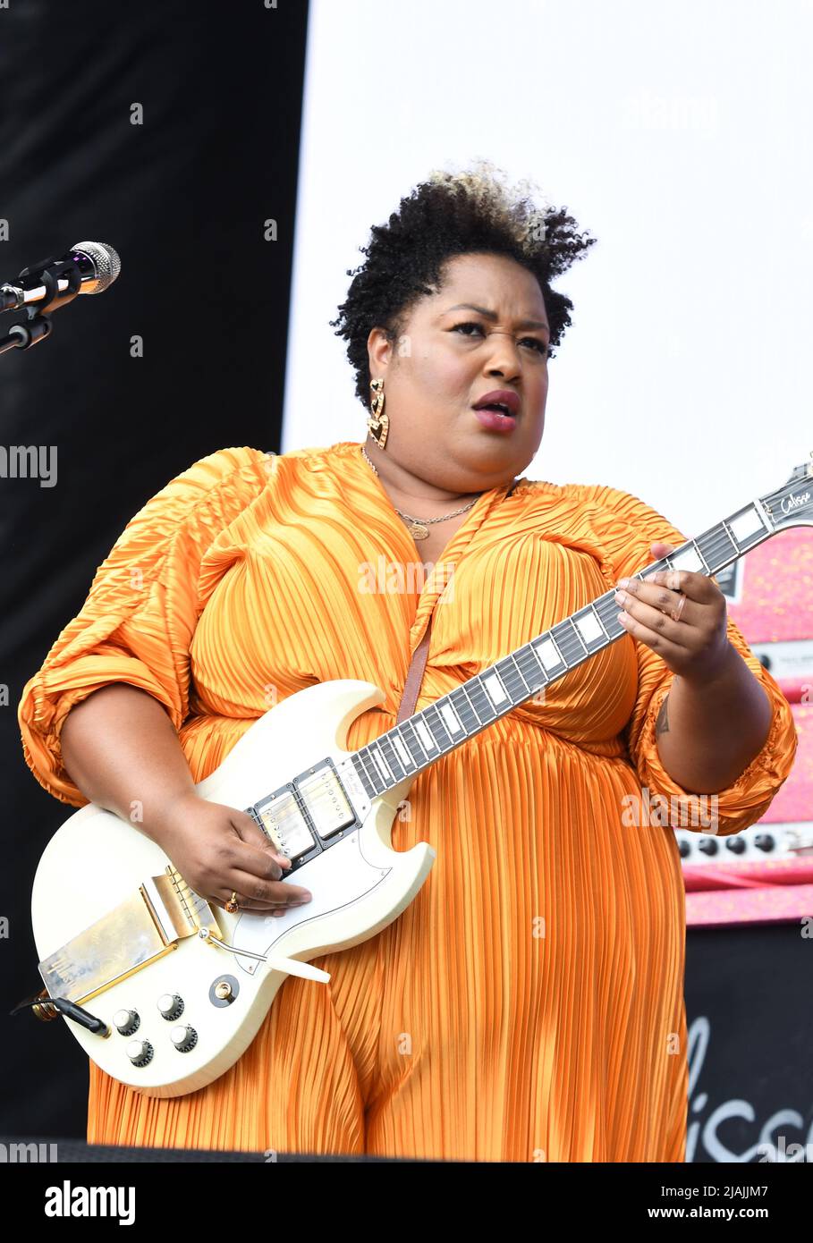 Singer, songwriter and guitarist Celisse is shown performing on stage ...