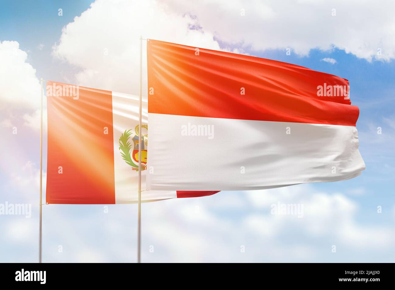 Sunny blue sky and flags of indonesia and peru Stock Photo - Alamy
